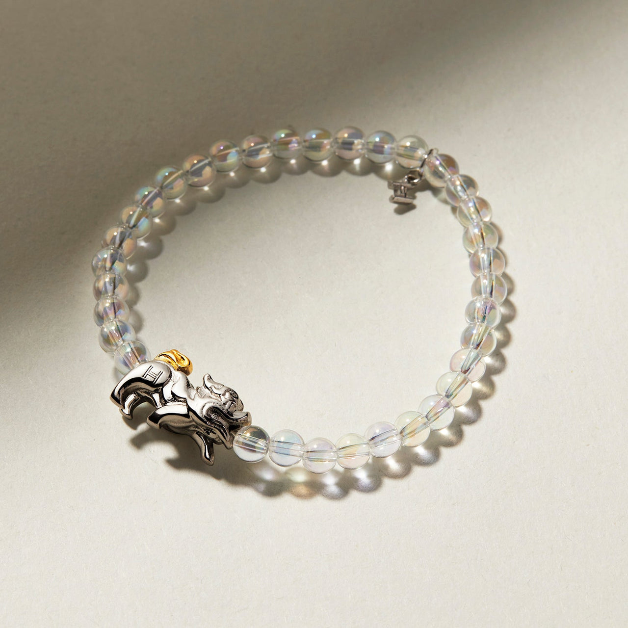 The Astrale - สร้อยข้อมือเทพเจ้าปี่เซียะมงคล อัญมณี Aurora Quartz ...